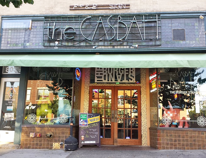 The tiled facade of The Casbah beckons like a culinary oasis on Massachusetts Street, promising burger nirvana behind those wooden doors.
