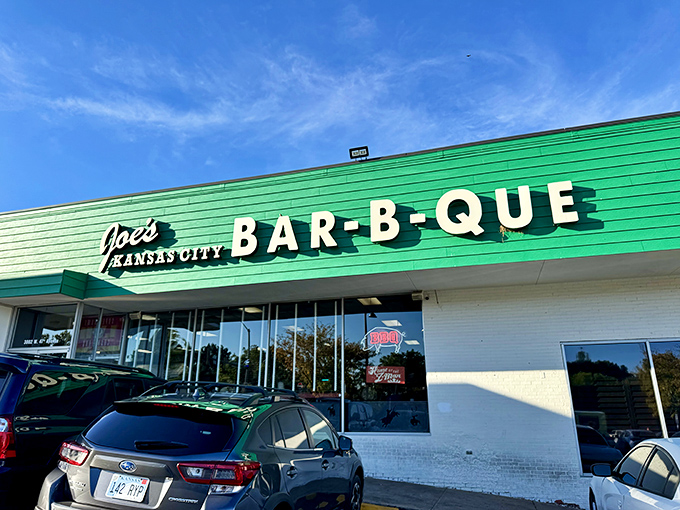 The iconic green exterior of Joe's KC BBQ beckons like a barbecue lighthouse, promising smoky treasures within this former gas station turned culinary landmark.