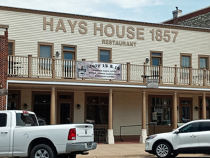 The white clapboard façade of Hays House stands proudly on Council Grove's main street, like a time machine disguised as a restaurant.