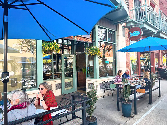 The iconic blue fish sign beckons seafood lovers like a lighthouse for the landlocked. A maritime oasis on Massachusetts Street.