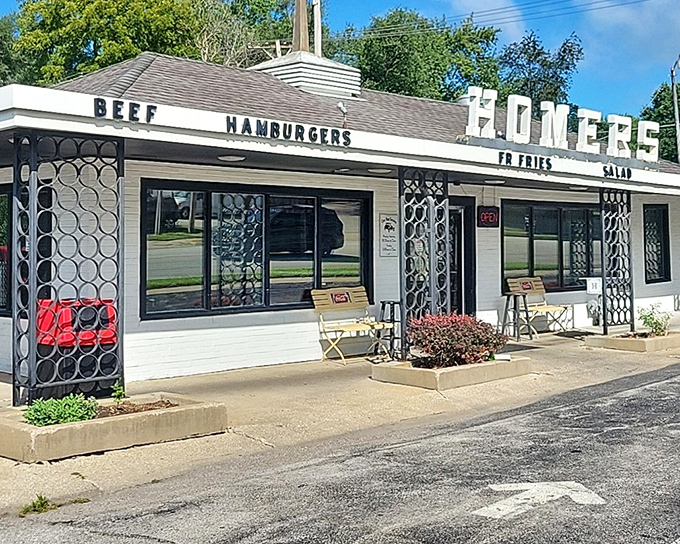 The classic diner beckons with its vintage signage proudly announcing "BEEF HAMBURGERS" – like a time portal to simpler, deliciously unpretentious days.