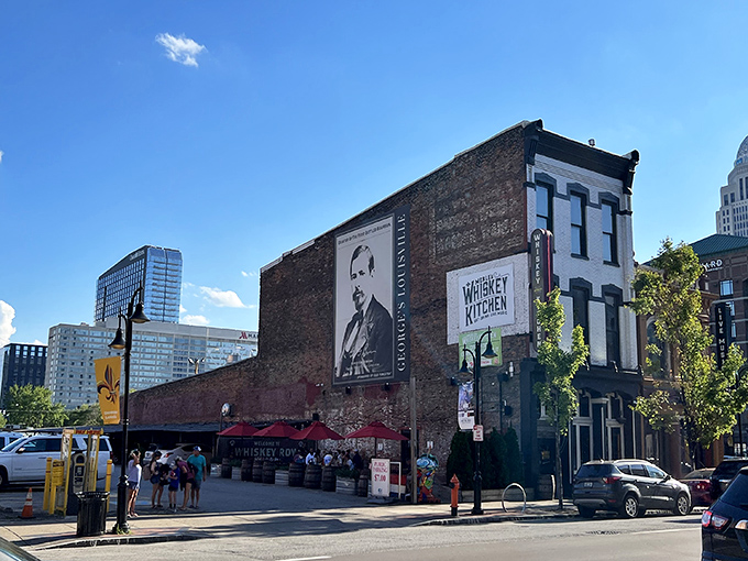 Historic brick meets modern Louisville skyline at Merle's Whiskey Kitchen, where bourbon country's culinary traditions come alive in the heart of Whiskey Row.