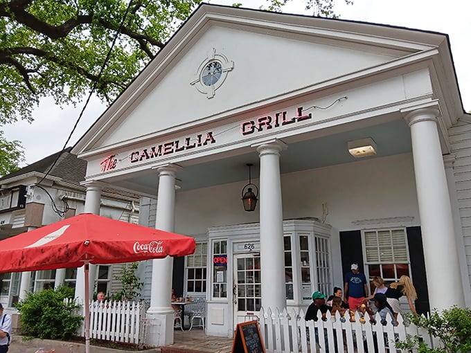 A Greek revival facade that houses burgers instead of philosophy&mdash;The Camellia Grill's columned entrance promises Southern hospitality with a side of architectural charm.