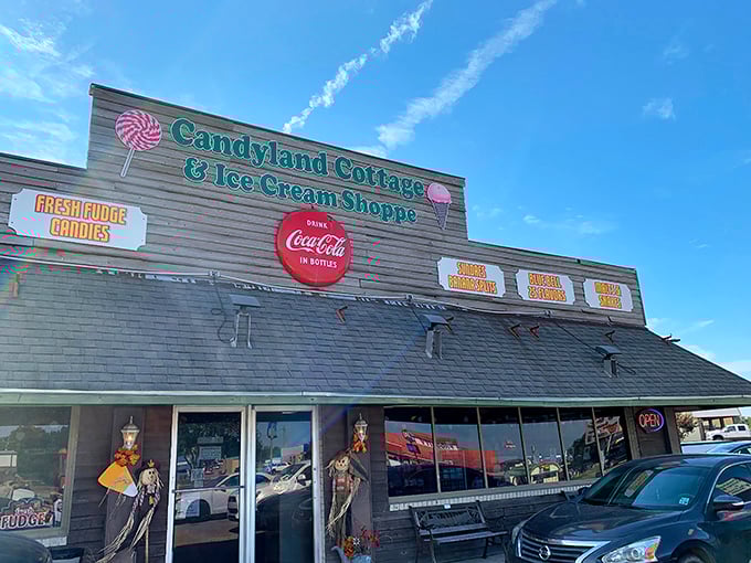 The charming exterior of Candyland Cottage beckons like a sweet mirage in Rayne, promising sugar-fueled nostalgia behind those vintage windows.