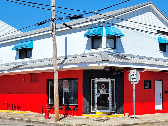 The red and white exterior of Chicken's Kitchen stands like a culinary lighthouse on Derbigny Street, beckoning hungry souls with promises of crispy perfection.