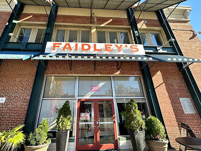 The brick facade and iconic blue awning of Faidley's stands like a seafood beacon in Baltimore, promising treasures of the Chesapeake within.