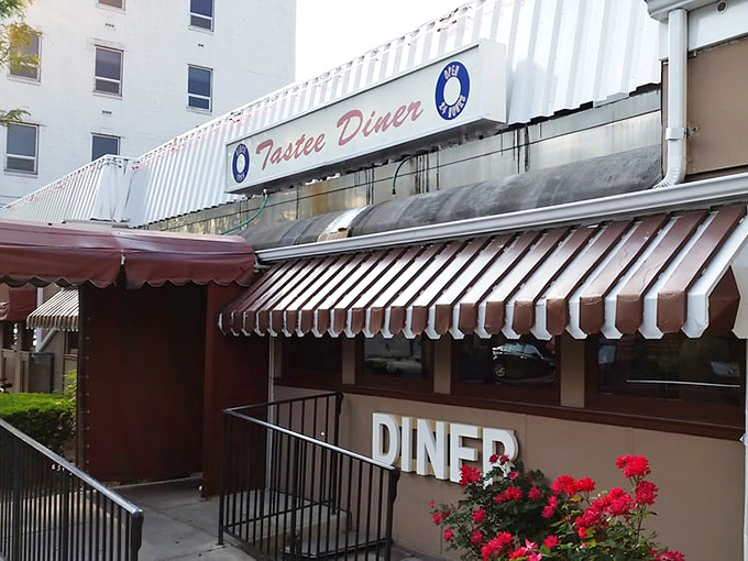 The iconic silver exterior of Tastee Diner stands as a time capsule amid Bethesda's modern landscape, like a chrome-plated guardian of comfort food traditions.