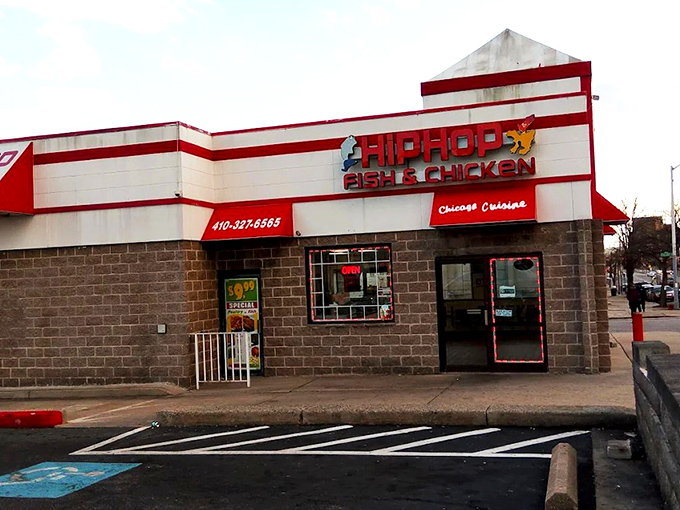 The red and white striped exterior of Hip Hop Fish & Chicken stands like a beacon of culinary promise on Baltimore's streets. Comfort food paradise awaits!