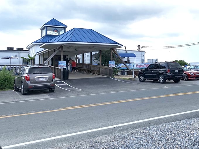 The blue-roofed beacon of seafood salvation beckons hungry travelers to Newburg's waterfront, where crab feasts and river views await.
