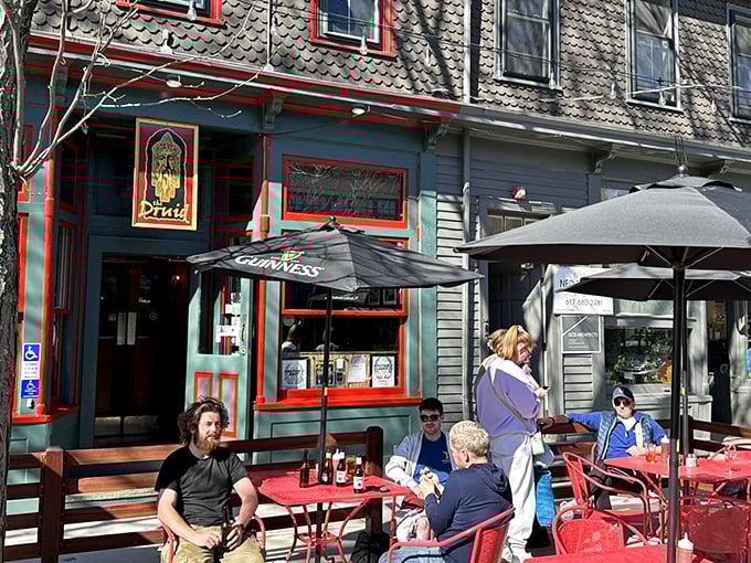 The emerald facade with cherry-red trim isn't just eye-catching&mdash;it's a promise that inside this unassuming Cambridge corner, culinary magic awaits.