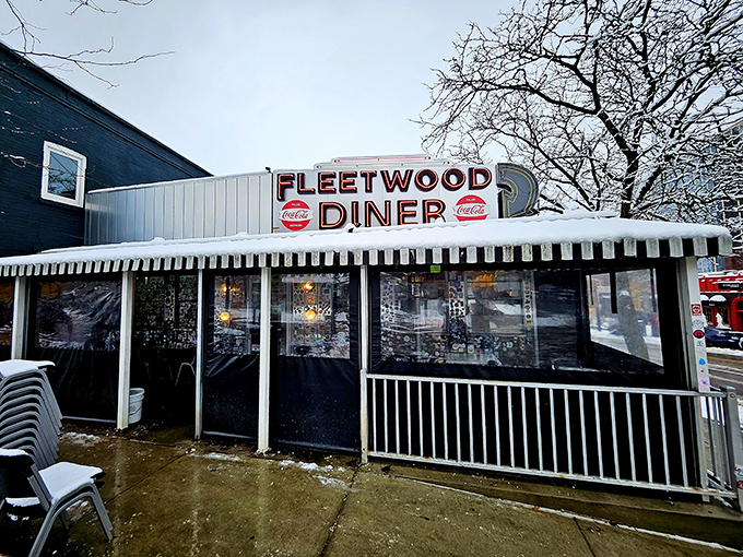 The iconic silver exterior of Fleetwood Diner gleams in the Michigan sunshine, a time capsule of Americana where hungry souls find refuge 24/7.