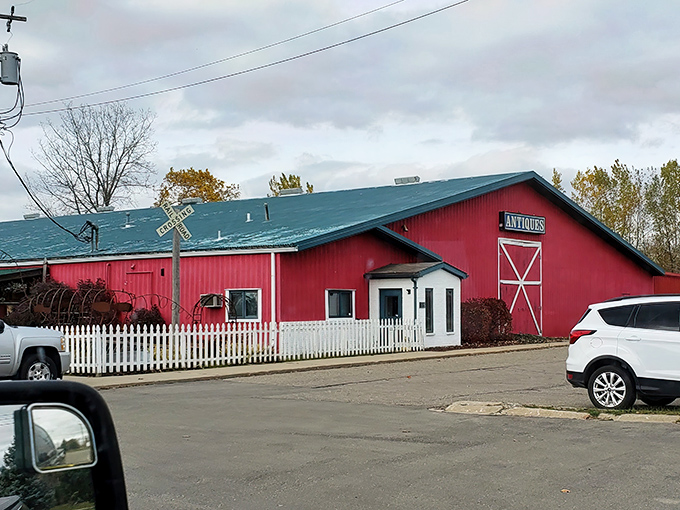 The iconic red barn exterior of Livingston Antique Outlet stands out against the Michigan sky like a beacon calling all treasure hunters home.