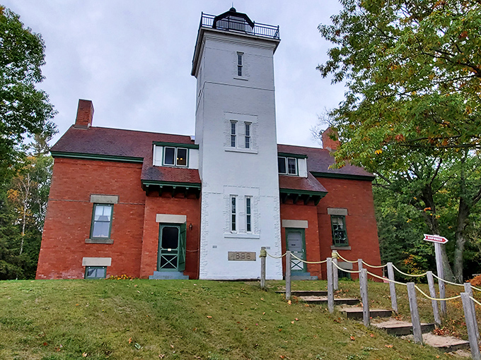The classic red brick and white tower combination makes 40 Mile Point Lighthouse look like it belongs on a postcard or perhaps your next holiday card.