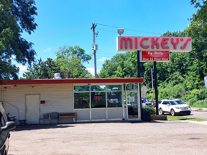 The red-roofed beacon of breakfast hope stands proudly against Minnesota's blue sky, promising comfort food that transcends time.