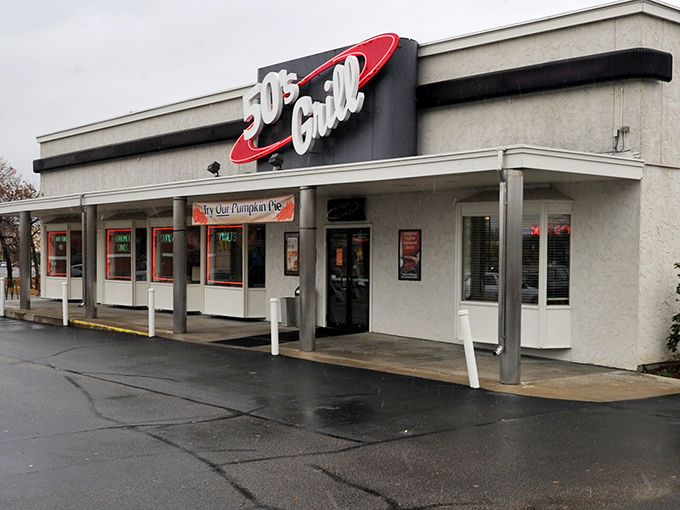 The retro red-and-white sign beckons like a time machine disguised as a restaurant. 50's Grill stands proudly against Minnesota's ever-changing skyline, promising comfort inside.