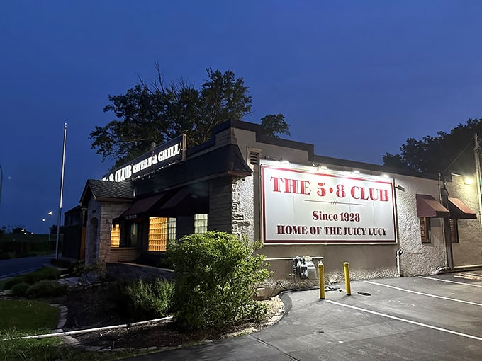 The unassuming exterior of 5-8 Club hides culinary greatness behind those burgundy awnings, proving that in Minnesota, legendary burgers don't need fancy facades.