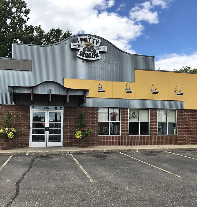 The yellow and gray exterior of The Patty Wagon stands like a beacon of comfort food hope in Minneapolis. No fancy frills, just delicious promises.