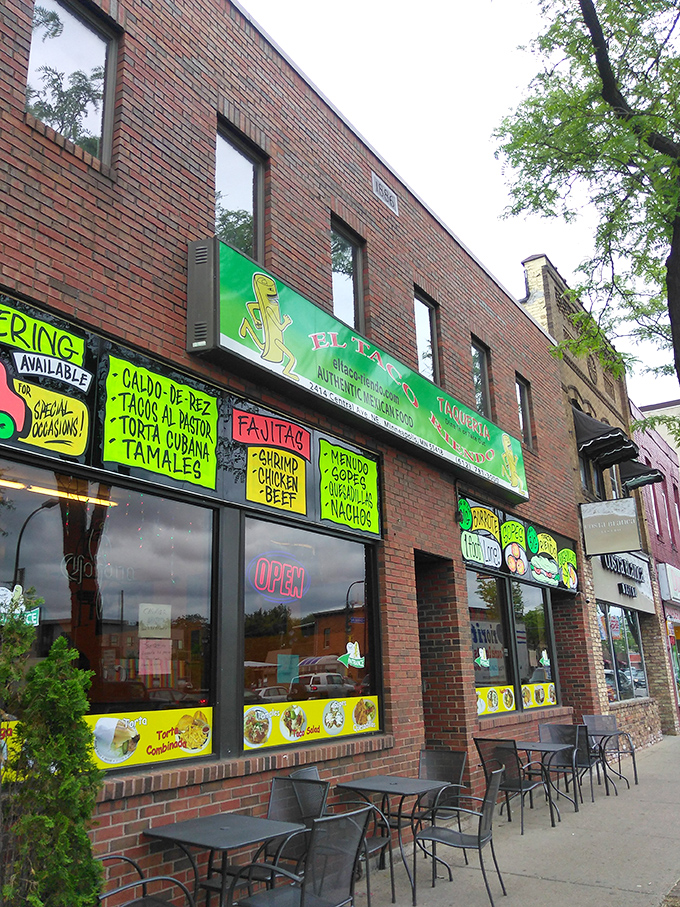El Taco Riendo's vibrant storefront announces its presence with neon-bright menu boards that practically scream, "Yes, this is the real deal!"