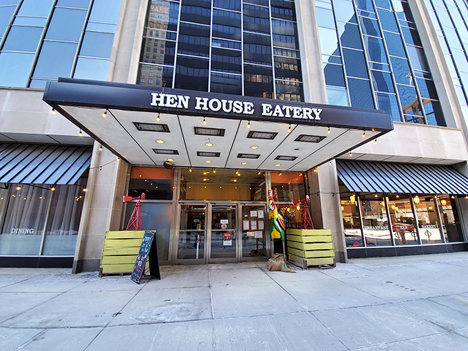 The blue awning of Hen House beckons like a breakfast lighthouse in downtown Minneapolis, promising morning salvation for hungry city dwellers.