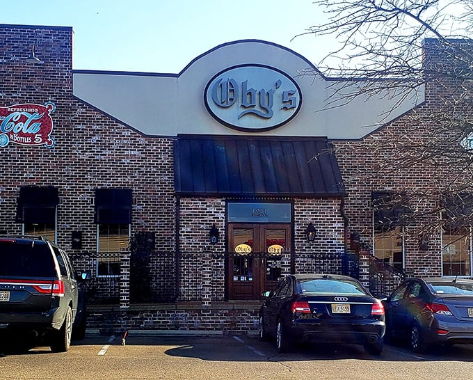Oby's brick exterior welcomes hungry visitors with its iconic oval sign&mdash;like a beacon of sandwich salvation in Oxford's culinary landscape.