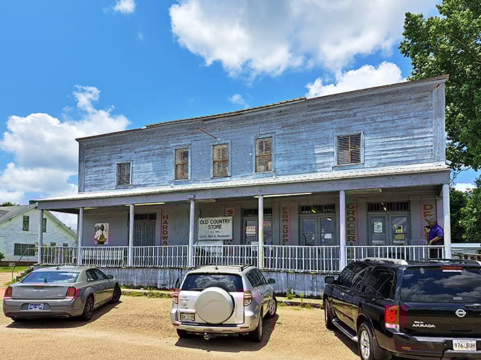 The weathered white clapboard exterior of The Old Country Store stands as a time capsule on Highway 61, promising culinary treasures within its humble walls.