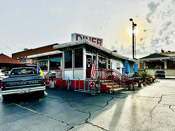 That iconic red DINER sign against the blue Missouri sky is like a beacon of breakfast hope for hungry souls. The American flag adds that perfect touch of hometown pride.