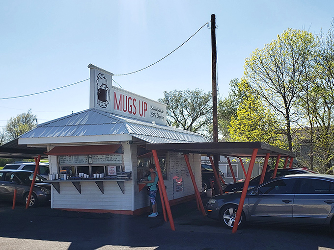 The humble white building with its distinctive orange-red supports stands like a time capsule of American drive-in culture. Simple perfection awaits.