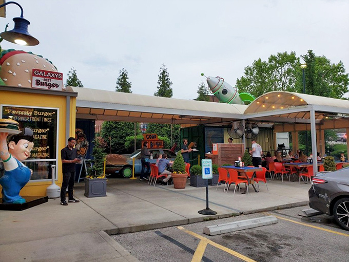 Welcome to burger paradise! Hi-Pointe Drive-In's whimsical exterior, complete with a giant burger sculpture, promises the kind of meal that makes grown adults giggle with anticipation.