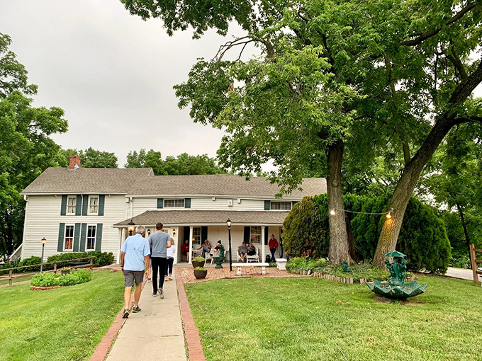 Home is where the chicken is! This inviting farmhouse exterior beckons hungry pilgrims on their quest for legendary pan-fried perfection.
