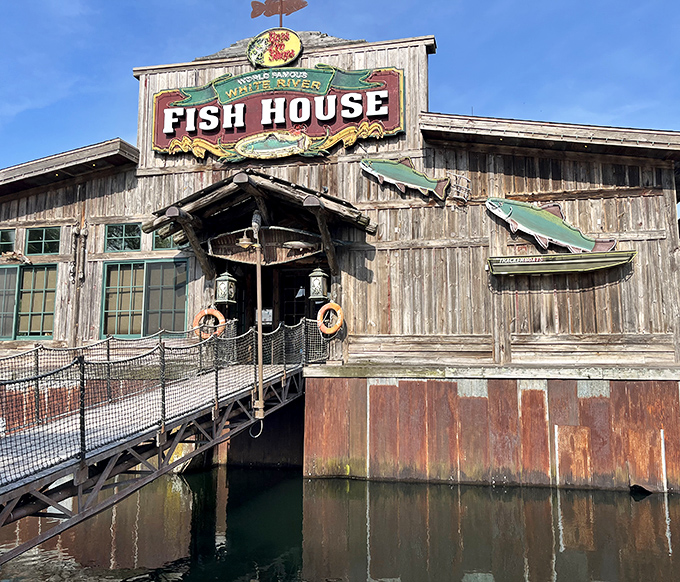 The rustic wooden exterior of White River Fish House beckons like an old friend, complete with that fish-shaped weather vane that seems to say "good catch inside!"