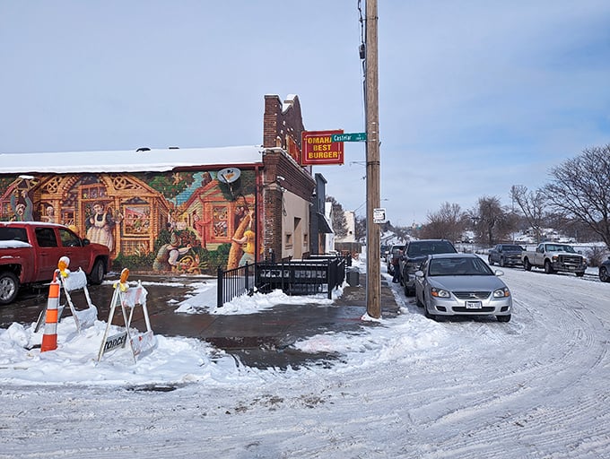 The neon doesn't lie! Dinker's iconic sign promises Omaha's best burger, and that brick exterior has witnessed decades of satisfied customers.