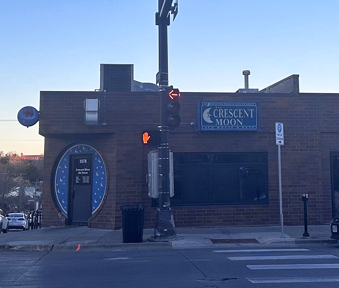 The iconic blue moon doorway beckons hungry travelers like a portal to sandwich paradise. Nebraska's culinary landmark hides in plain sight.