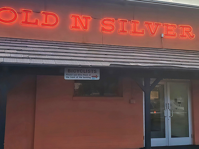The iconic orange exterior with glowing red signage announces itself like Vegas neon for the hungry. No pretension, just breakfast promise.
