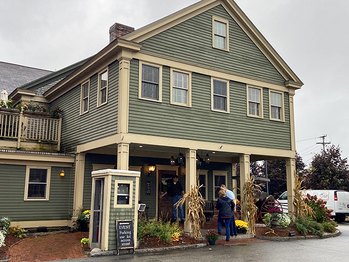 The quintessential New England welcome! This charming green colonial exterior promises comfort food treasures within, like finding Grandma's house if Grandma were a culinary genius.