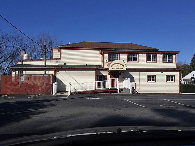 The unassuming exterior of Pasta Loft belies the culinary treasures within. That bicycle on the roof? It's how the staff burns off all those carbs.