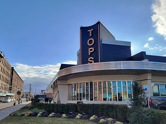 The iconic blue and silver fa&ccedil;ade of Tops Diner stands proudly against the New Jersey sky, like a beacon calling hungry travelers home.