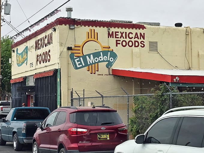 The unassuming exterior of El Modelo stands like a culinary lighthouse in Albuquerque's Barelas neighborhood, beckoning hungry pilgrims with its iconic Zia symbol.