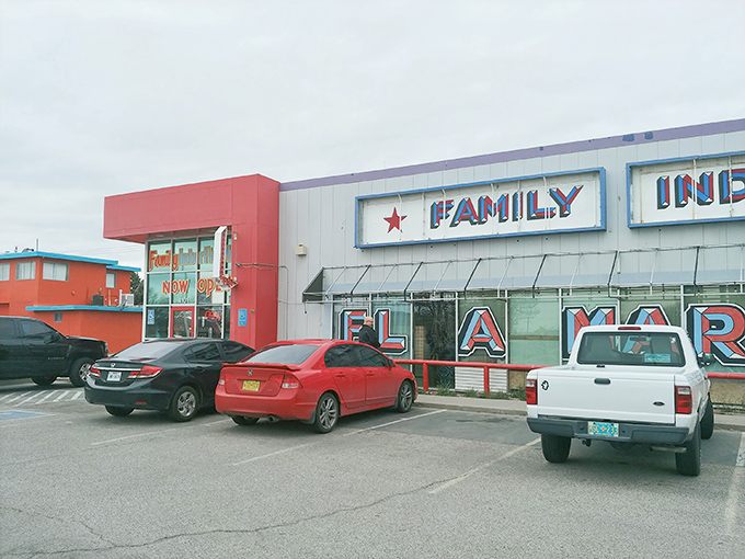 The red and white fa&ccedil;ade of Family Indoor Flea Market stands like a beacon for treasure hunters. Bargain paradise awaits behind those doors!