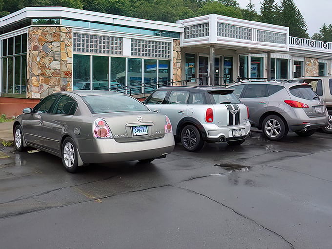 The stone facade and iconic blue signage of the "World Famous" Roscoe Diner stands as a beacon for hungry travelers along Route 17, promising comfort food salvation ahead.