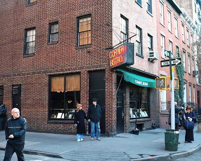 The neon glow of Corner Bistro's sign beckons hungry pilgrims like a burger lighthouse in the West Village night. New York's culinary North Star.