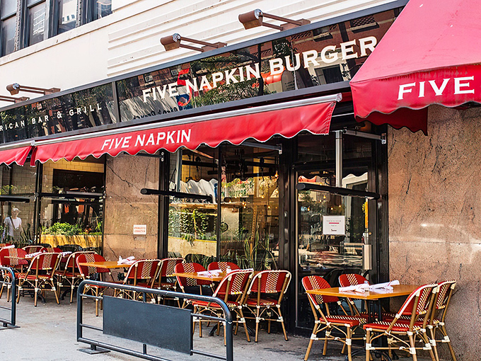 That iconic red awning is like a beacon for burger lovers navigating the urban jungle. Sidewalk seating beckons with prime people-watching possibilities.