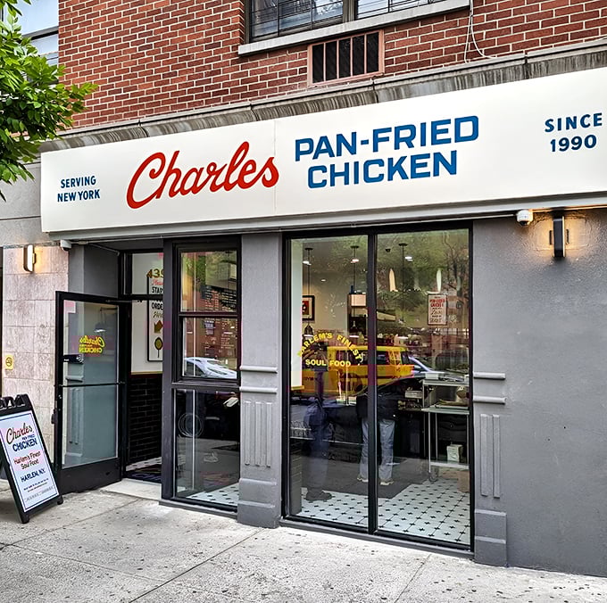 The storefront beckons like a lighthouse for hungry souls, its classic red and blue signage promising salvation from mediocre chicken since 1990.