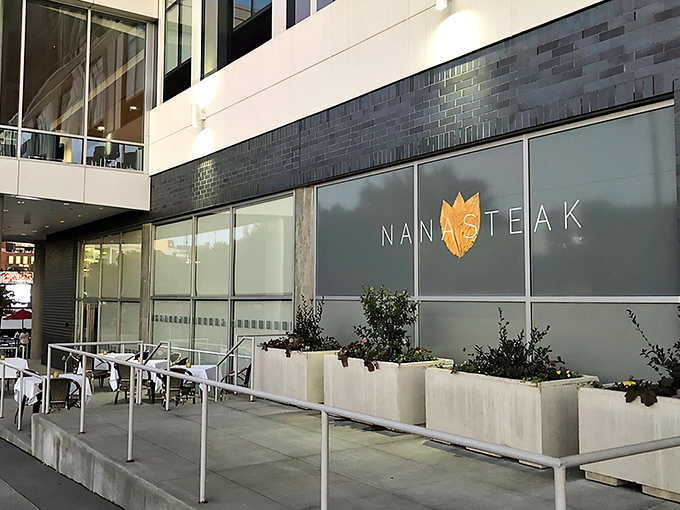 NanaSteak's illuminated sign beckons like a lighthouse for hungry souls wandering the streets of Durham, promising salvation in steak form.