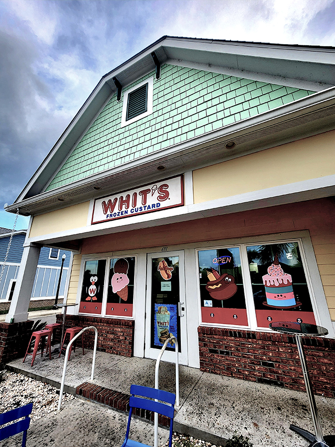 The mint-green beach cottage with its cheerful "WHIT'S FROZEN CUSTARD" sign promises sweet relief from the Carolina heat. Vacation mode: activated.