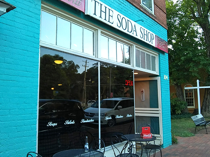 The turquoise facade of The Soda Shop stands out like a nostalgic beacon on Davidson's Main Street, promising comfort and conversation in equal measure.