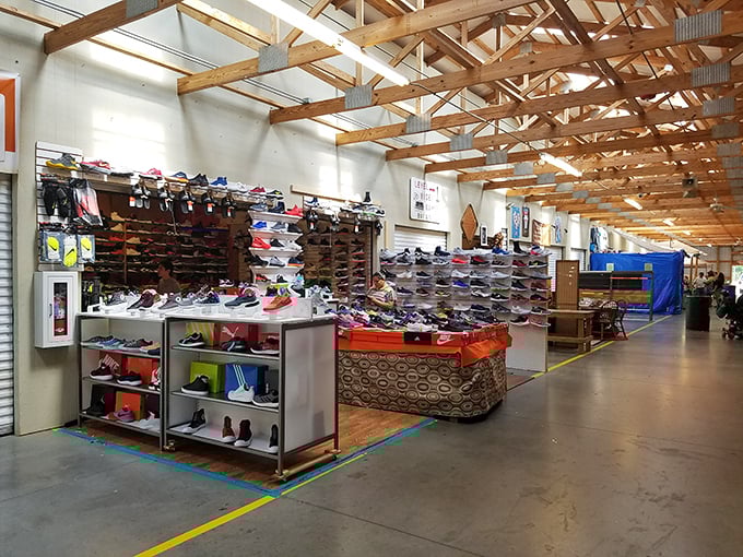 Treasure hunters paradise! Cardboard boxes overflow with affordable finds while shoppers navigate the labyrinth of vendor stalls in search of their next great discovery.