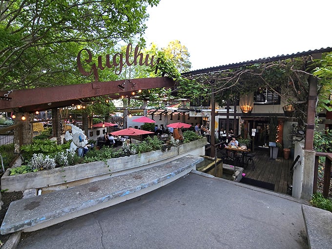 A slice of Bavaria in Durham! This charming outdoor patio is where lederhosen meets Southern hospitality, complete with red umbrellas that pop like cherry tomatoes in a garden salad.