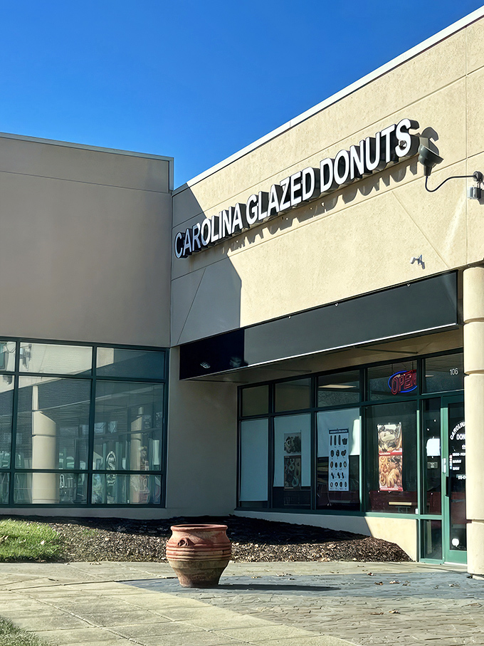 The unassuming storefront of Carolina Glazed Donuts might not stop traffic, but what's inside will stop you in your tracks. Sweet treasures await behind that modest exterior. 
