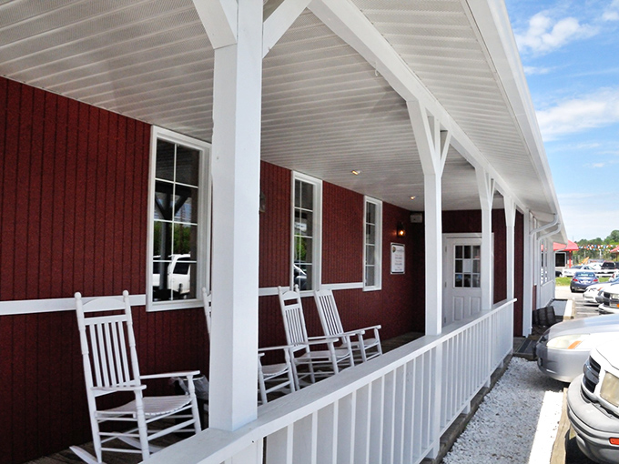The classic red exterior with white rocking chairs isn't just Southern charm&mdash;it's the universal signal that life-changing barbecue awaits inside.