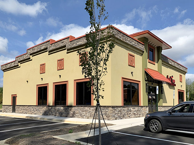 The golden-hued exterior of Aye! Toro stands like a beacon of culinary promise in Pittsboro, its terracotta accents and stonework hinting at the authentic flavors waiting inside.